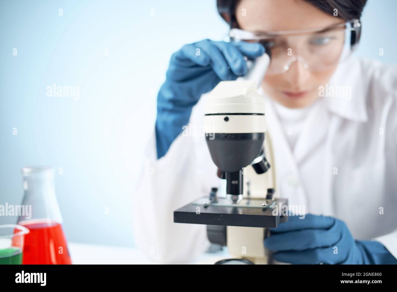 Woman in white coat laboratory science microscope Stock Photo - Alamy