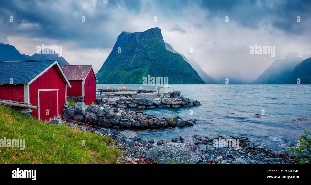 Colorful night scene of Hjorundfjorden fjord, Orsta municipality, More ...