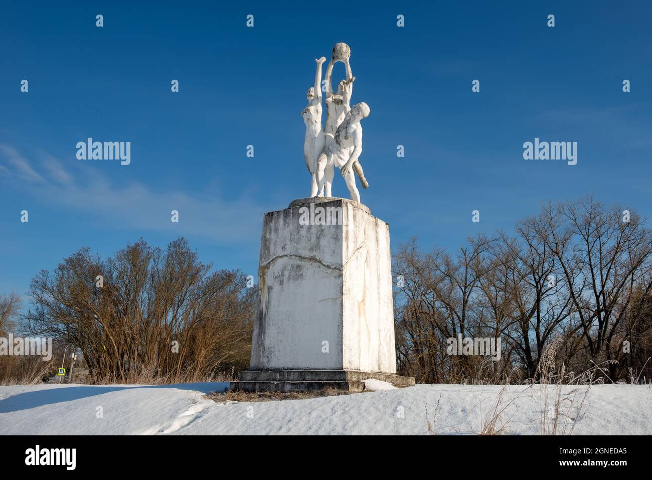 Genre sculpture Volleyball players (1937) installed on the barrier gate ...