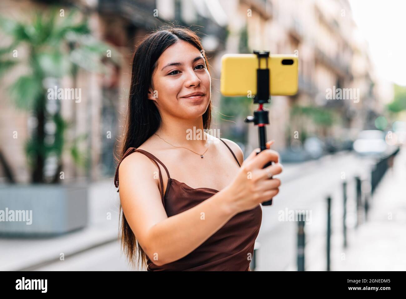 attractive young asian woman vlogging with her smart phone in the ...