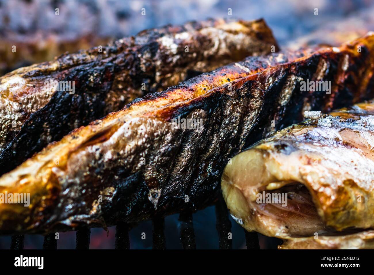 Grilled fish on charcoal grill. Fresh fish barbecue Stock Photo - Alamy