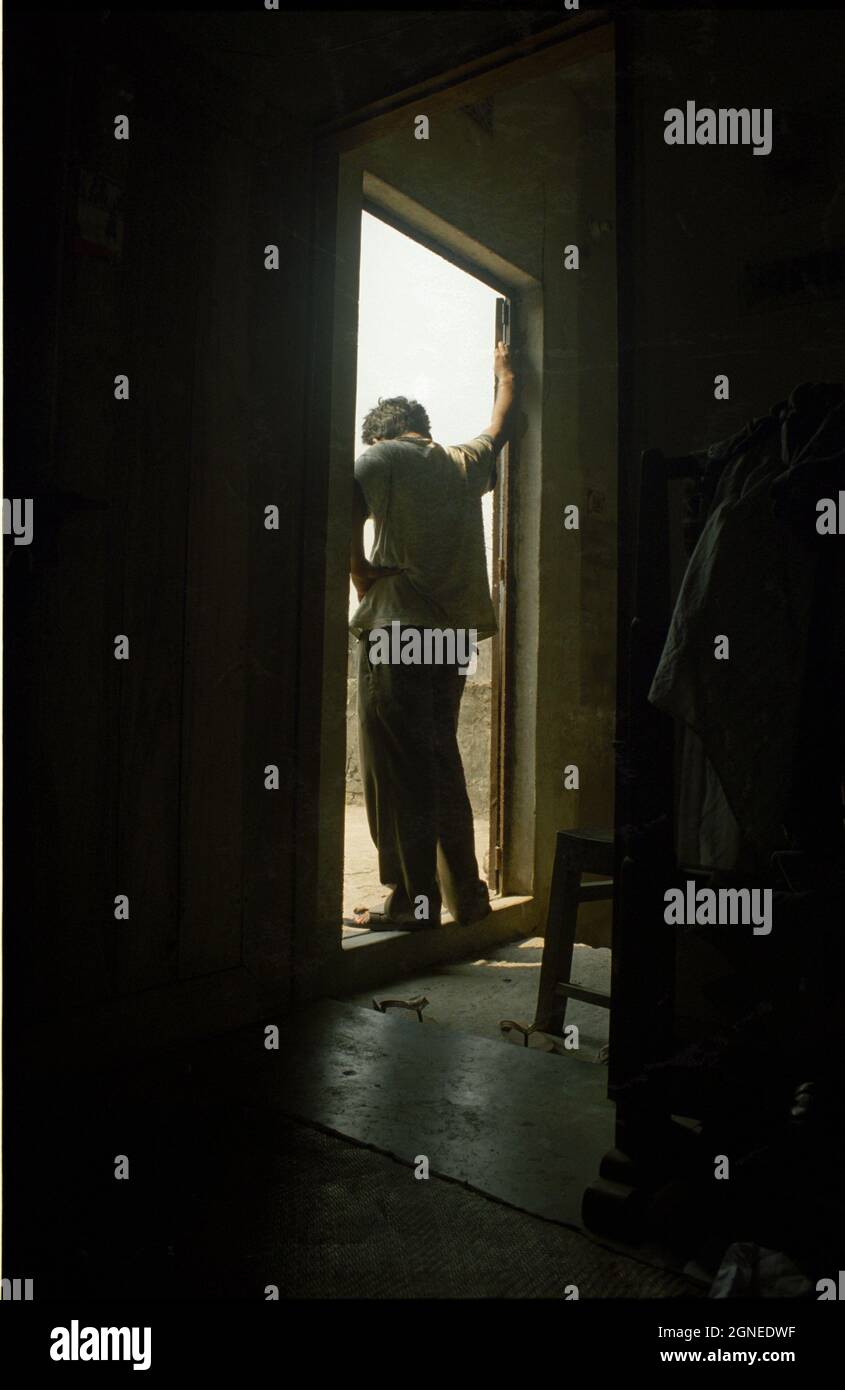 A man standing near his doorway at his house. Bangladesh Stock Photo ...