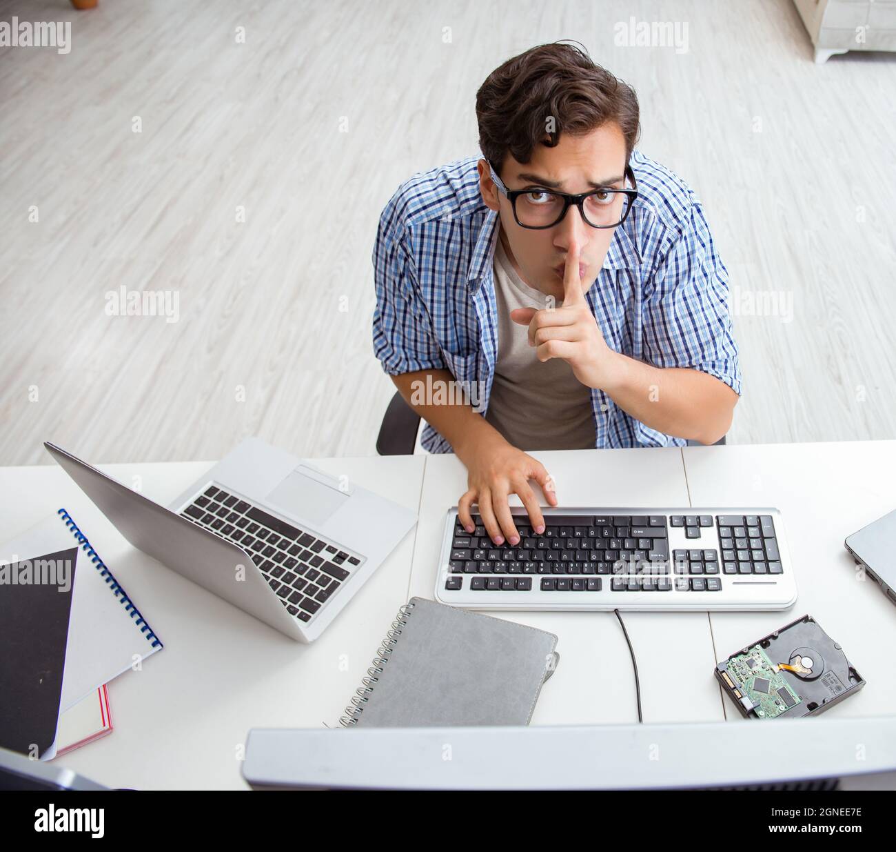 The young trader monitoring markets on screens Stock Photo - Alamy