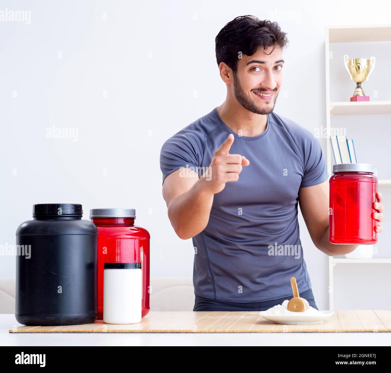 The athlete tasting new protein supplements for better muscles Stock ...