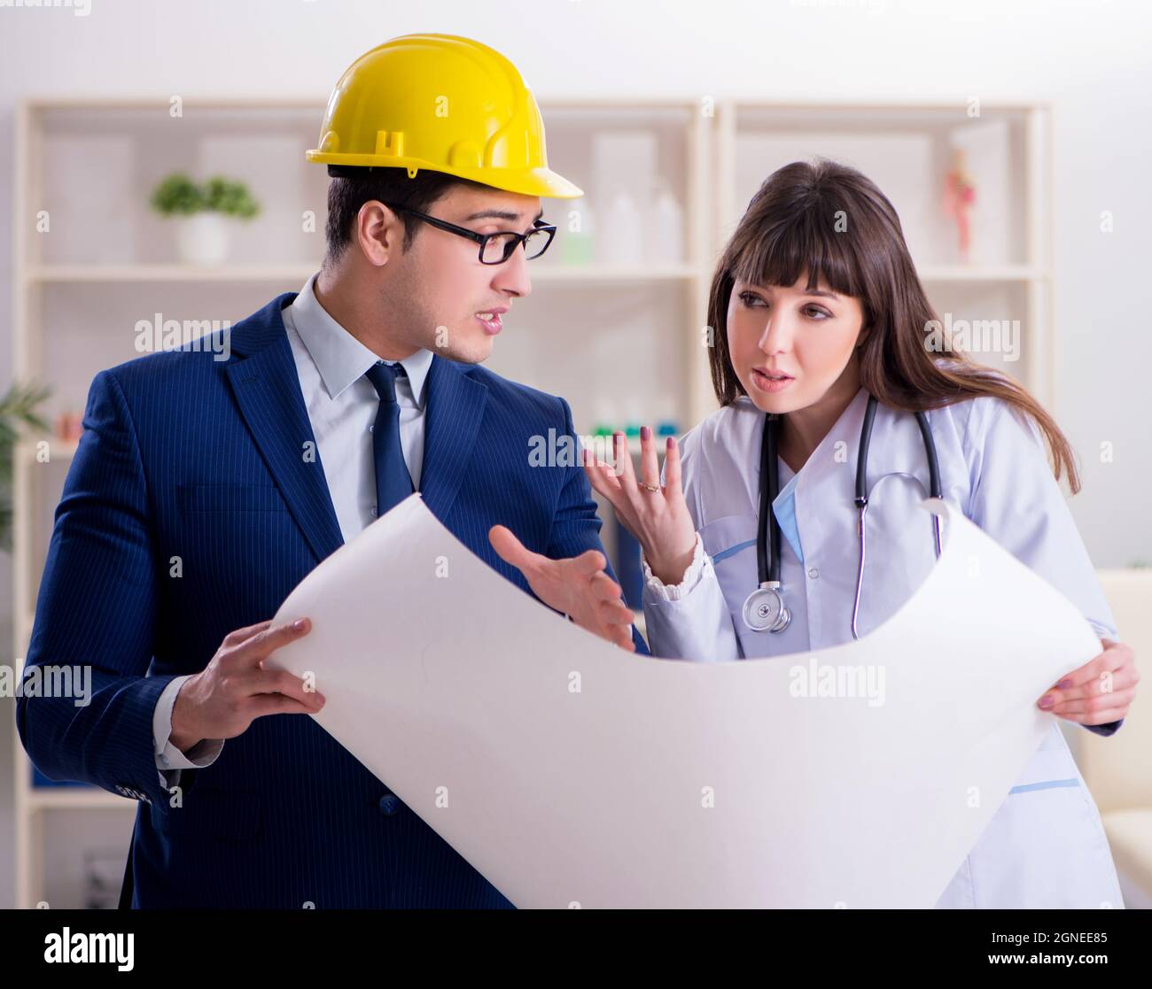 The doctor discussing new hospital plan with architect Stock Photo - Alamy
