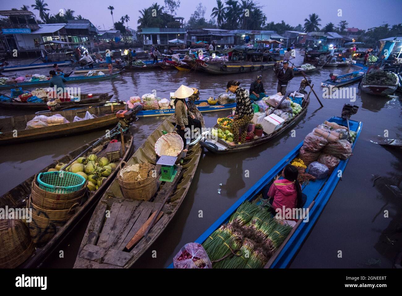 Aerial view of Phong Dien floating market at sunrise, boats selling ...