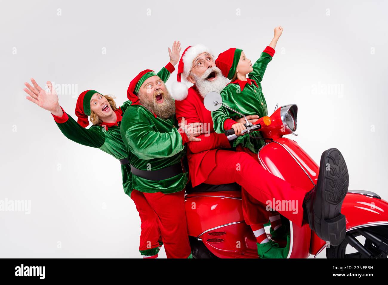 Portrait of nice carefree cheerful funky friends riding motor bike ...