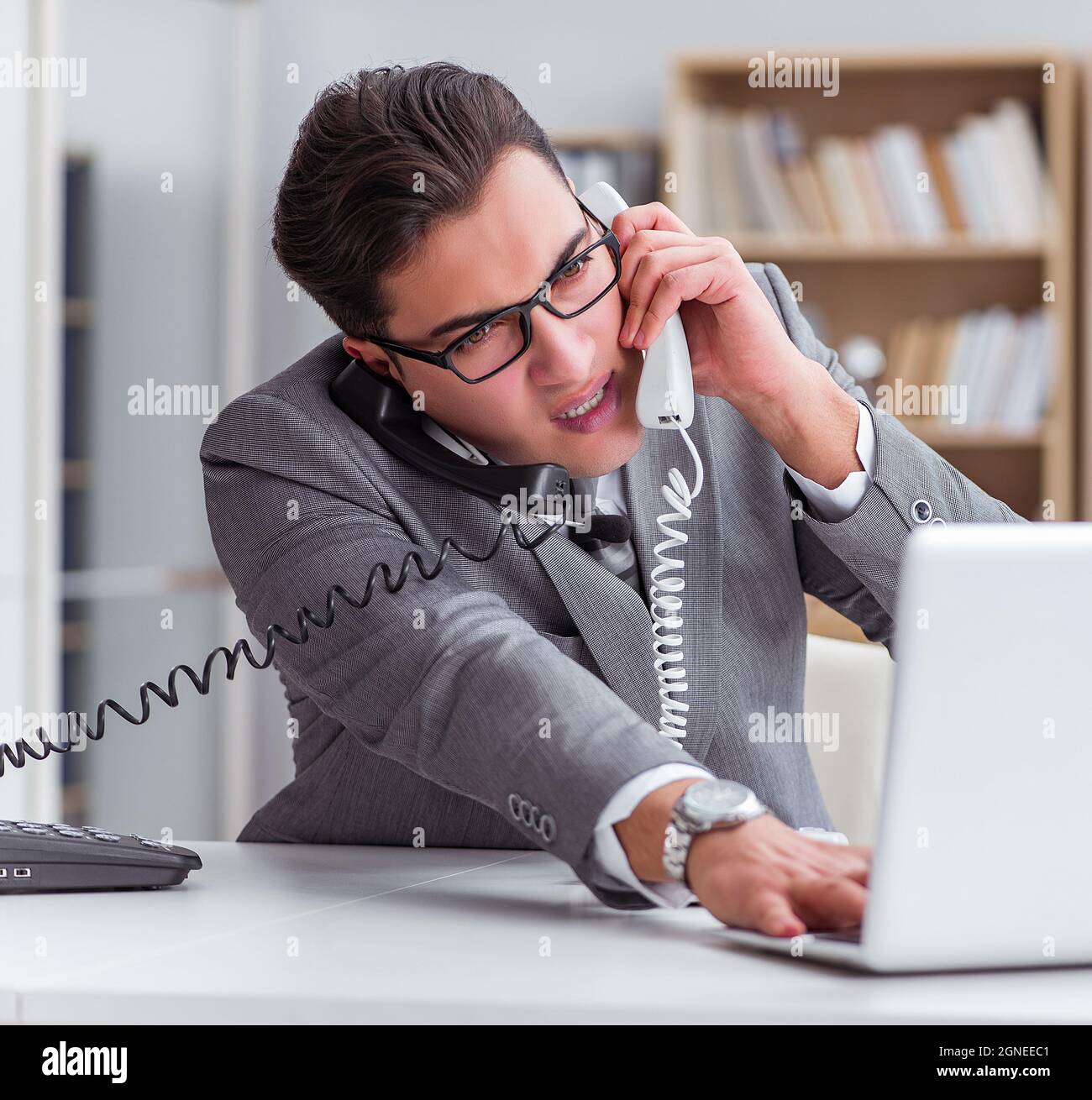 The angry helpdesk operator in the office Stock Photo - Alamy