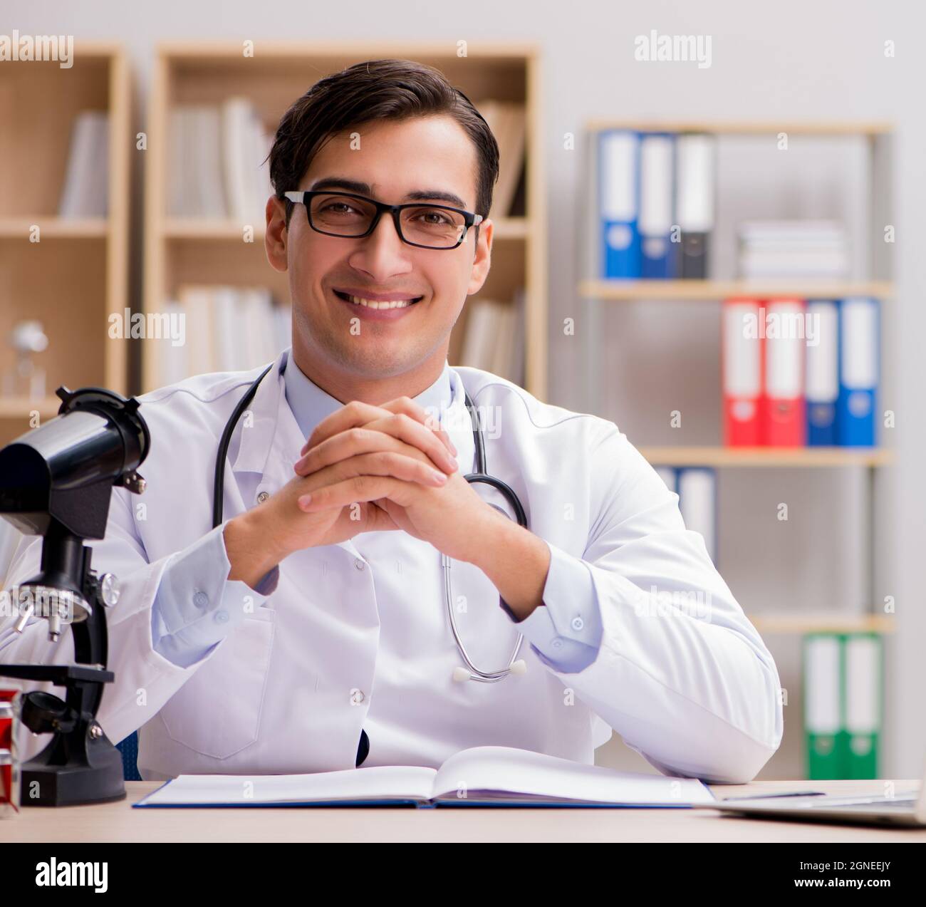 The young adult doctor working in the hospital Stock Photo - Alamy