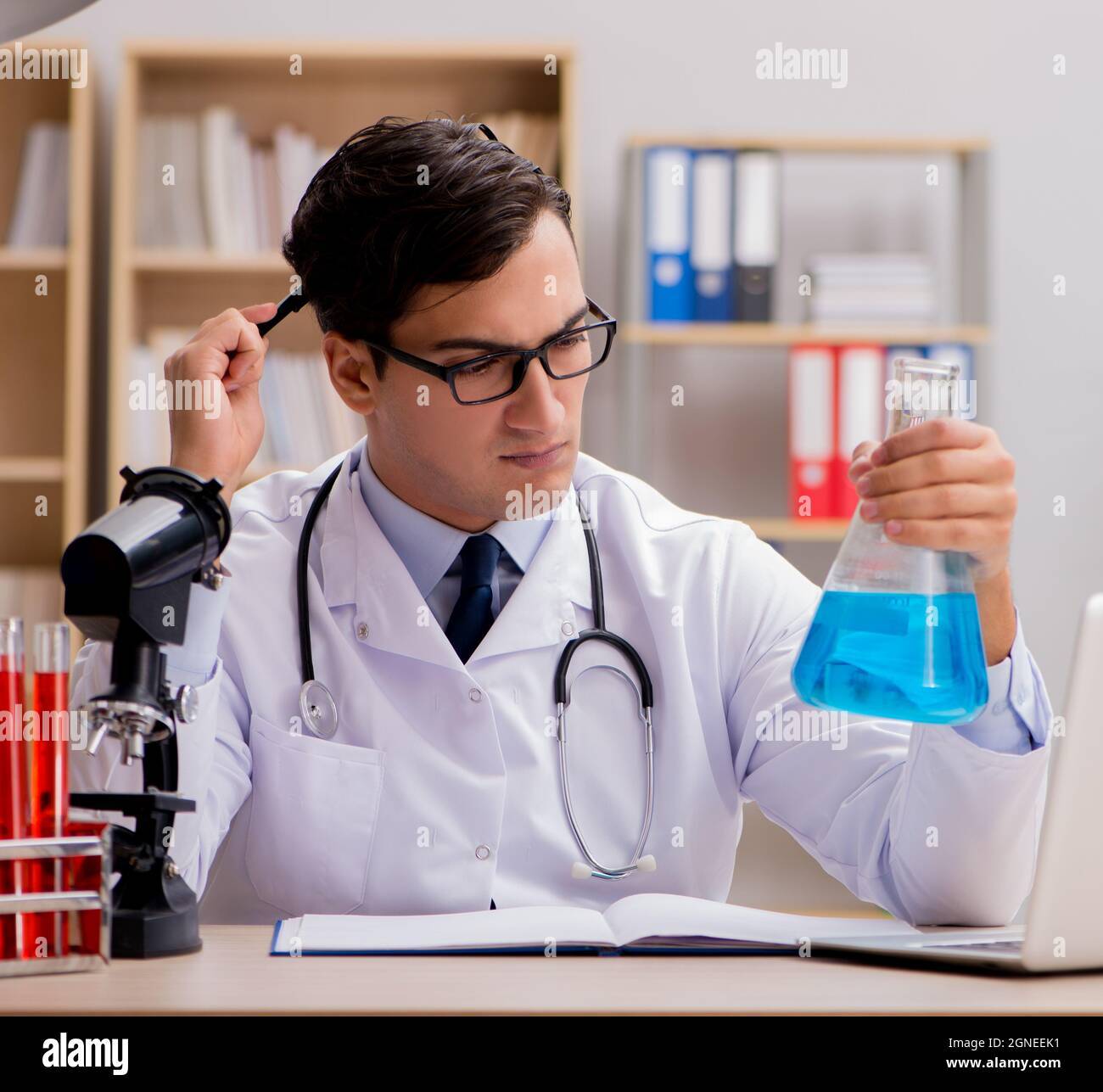 The man doctor working in the lab Stock Photo - Alamy