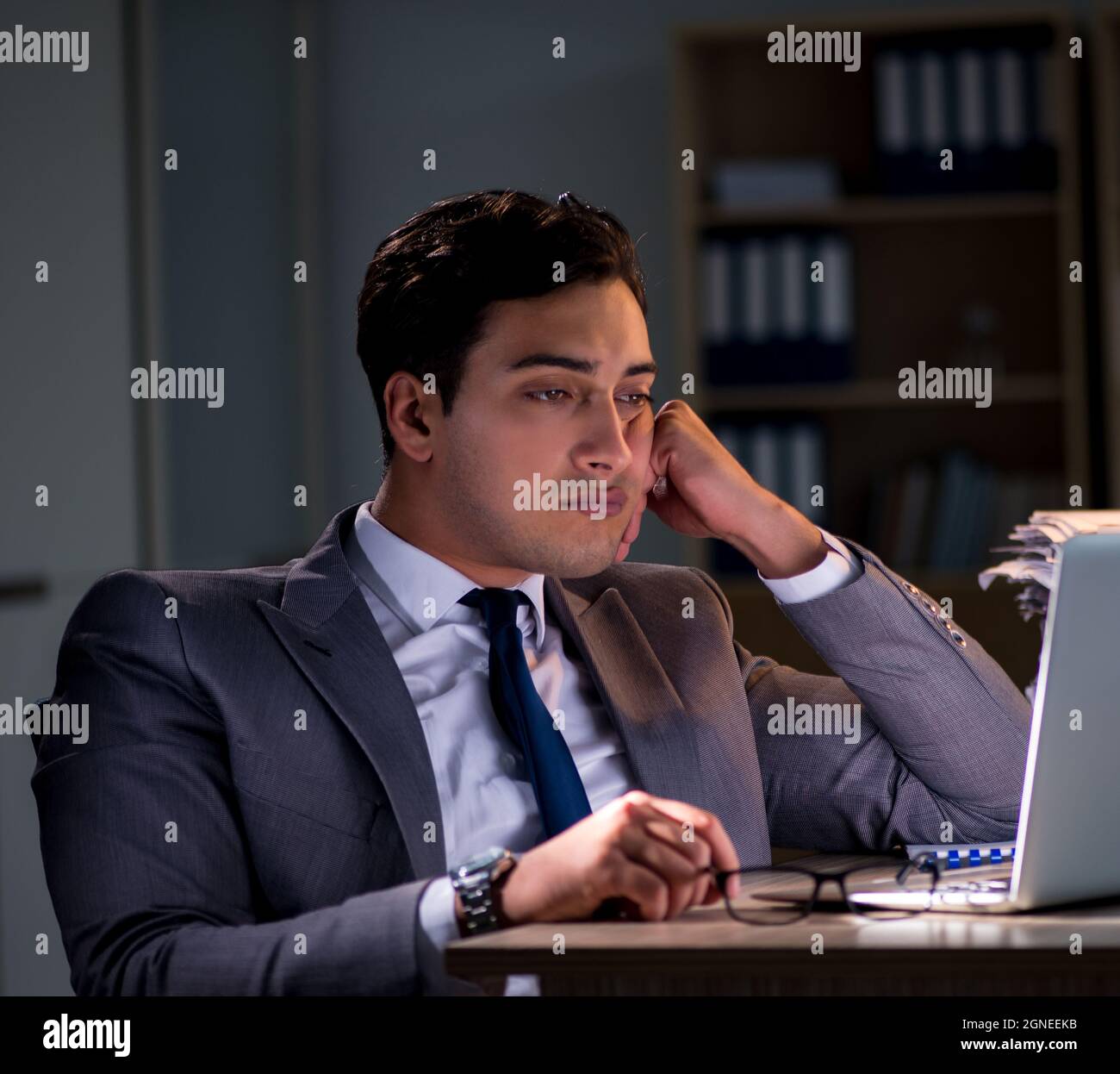 The man staying in the office for long hours Stock Photo - Alamy