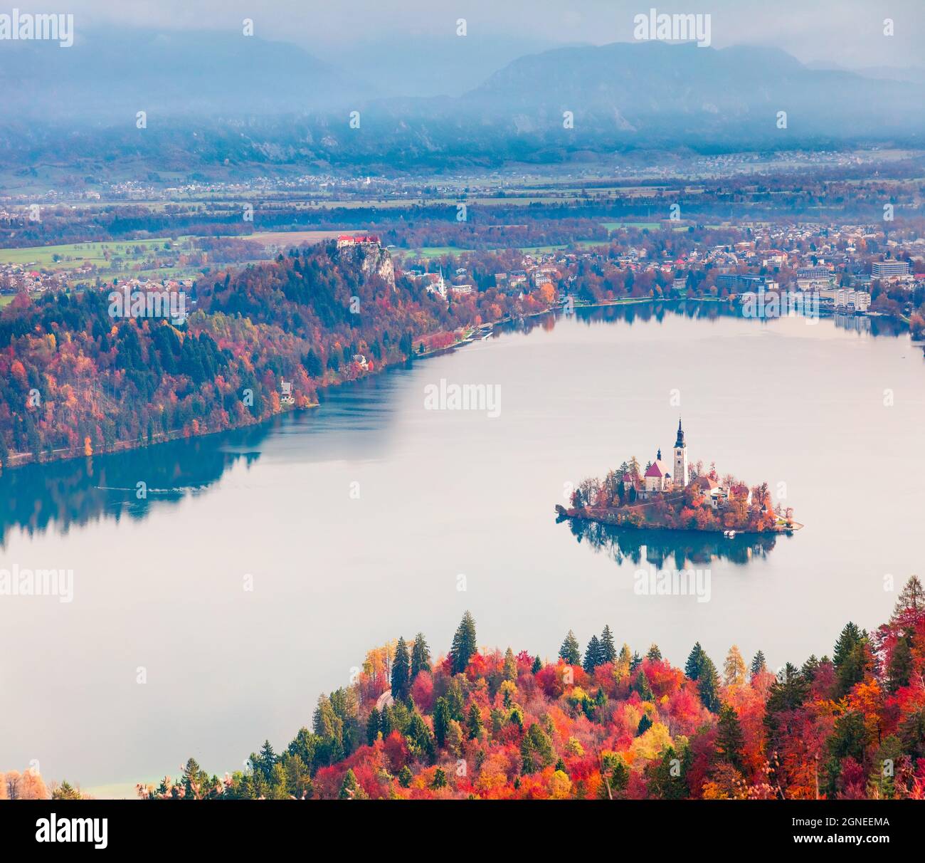 Aerial view of church of Assumption of Maria on the Bled lake. Foggy ...