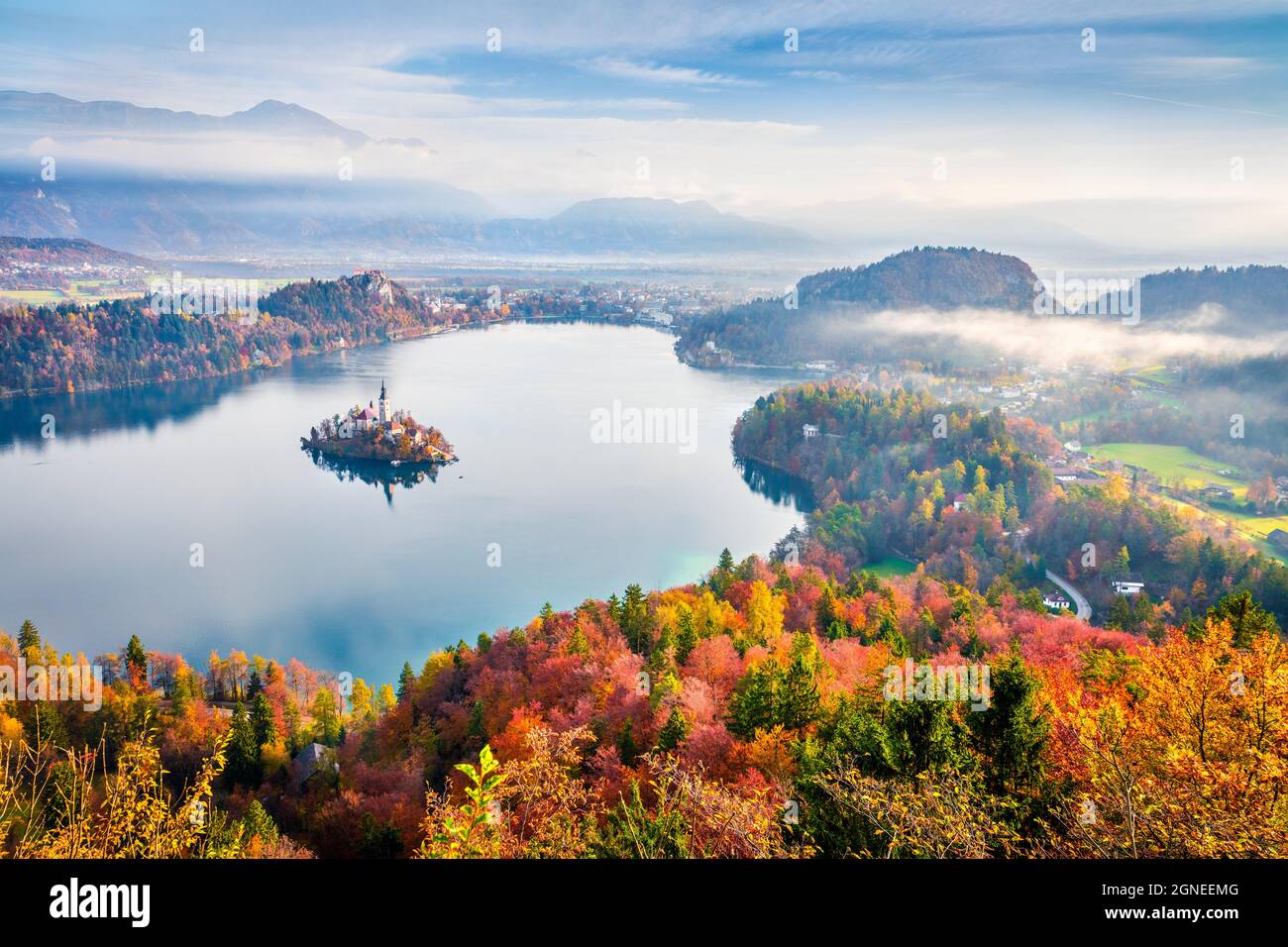 Aerial view of church of Assumption of Maria on the Bled lake. Foggy ...