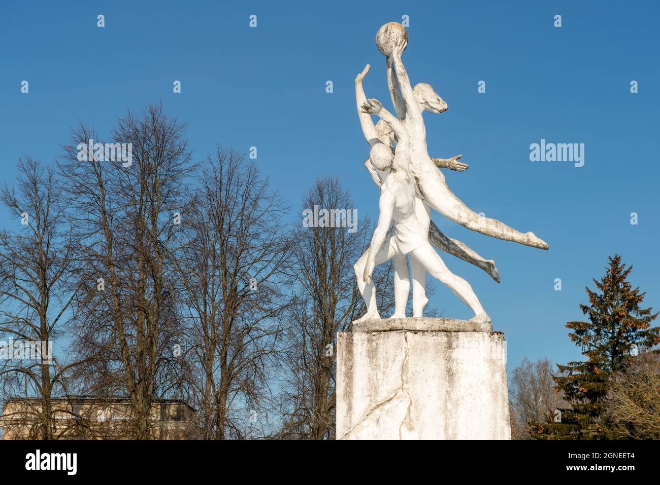 Genre sculpture Volleyball players (1937) installed on the barrier gate ...