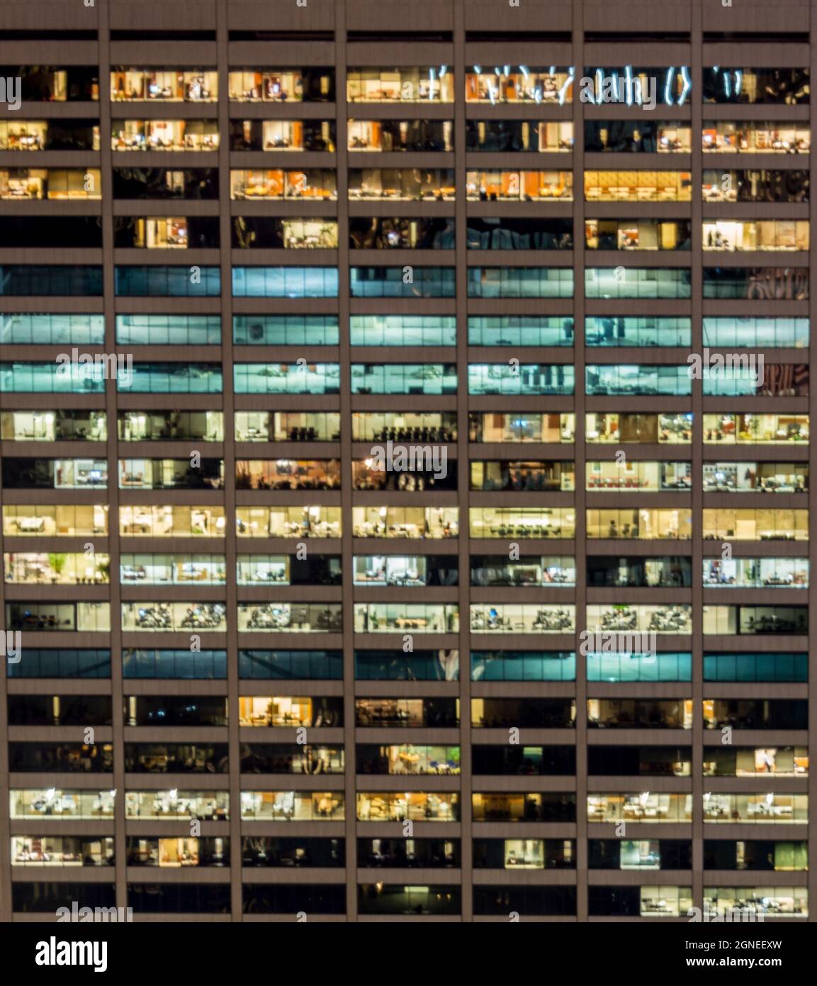 The office windows illuminated at night Stock Photo - Alamy