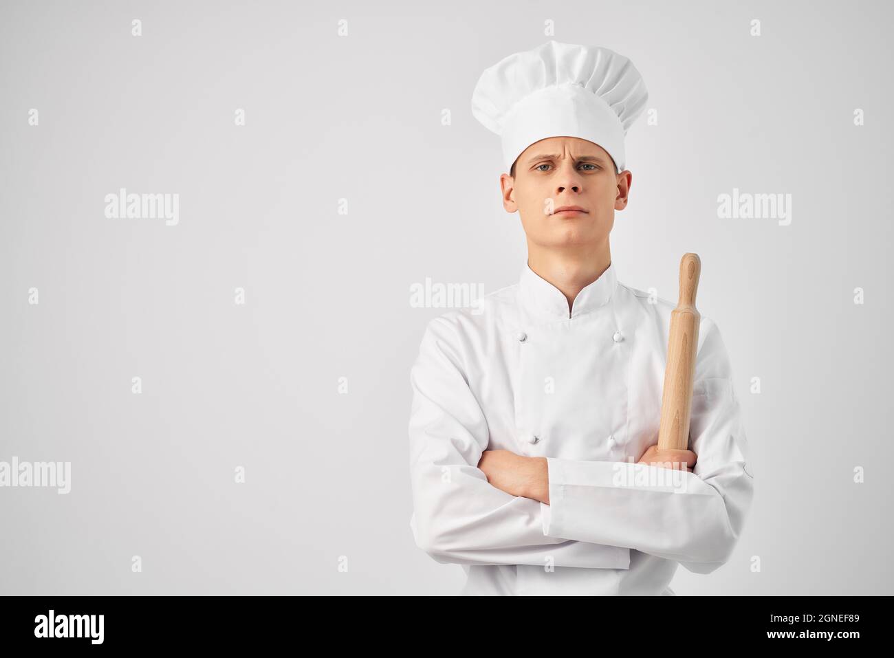 chef with a white cap on his head kitchenware cooking Stock Photo - Alamy
