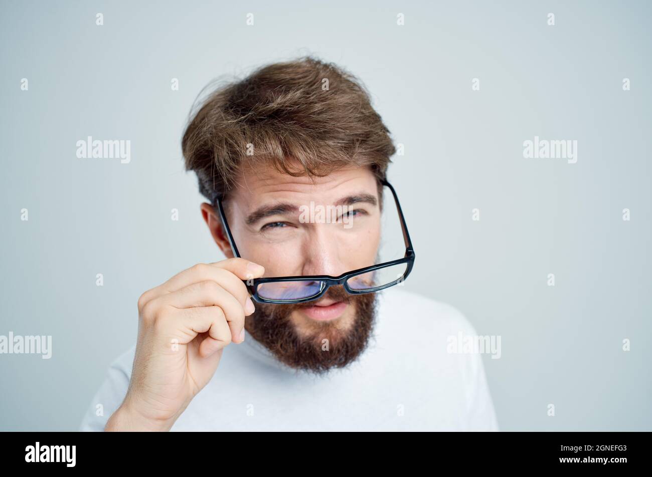 man with poor eyesight health problems light background Stock Photo - Alamy