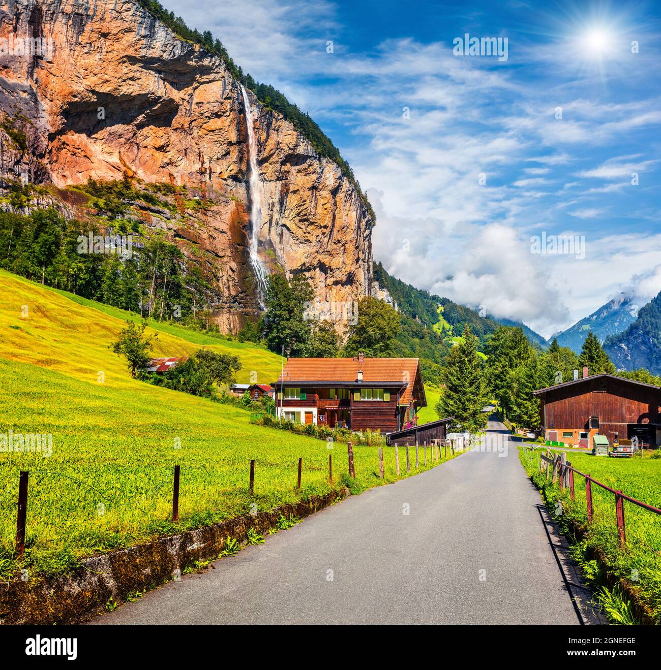 Splendid summer view of waterfall in Lauterbrunnen village. Splendid ...