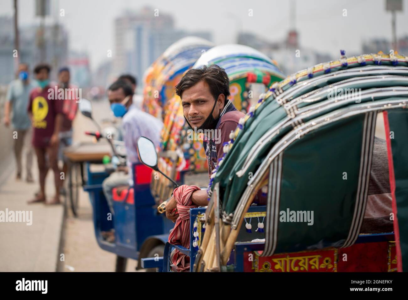 During the lock down situation Rikshaw puller are waiting on the road for passenger. If they ...
