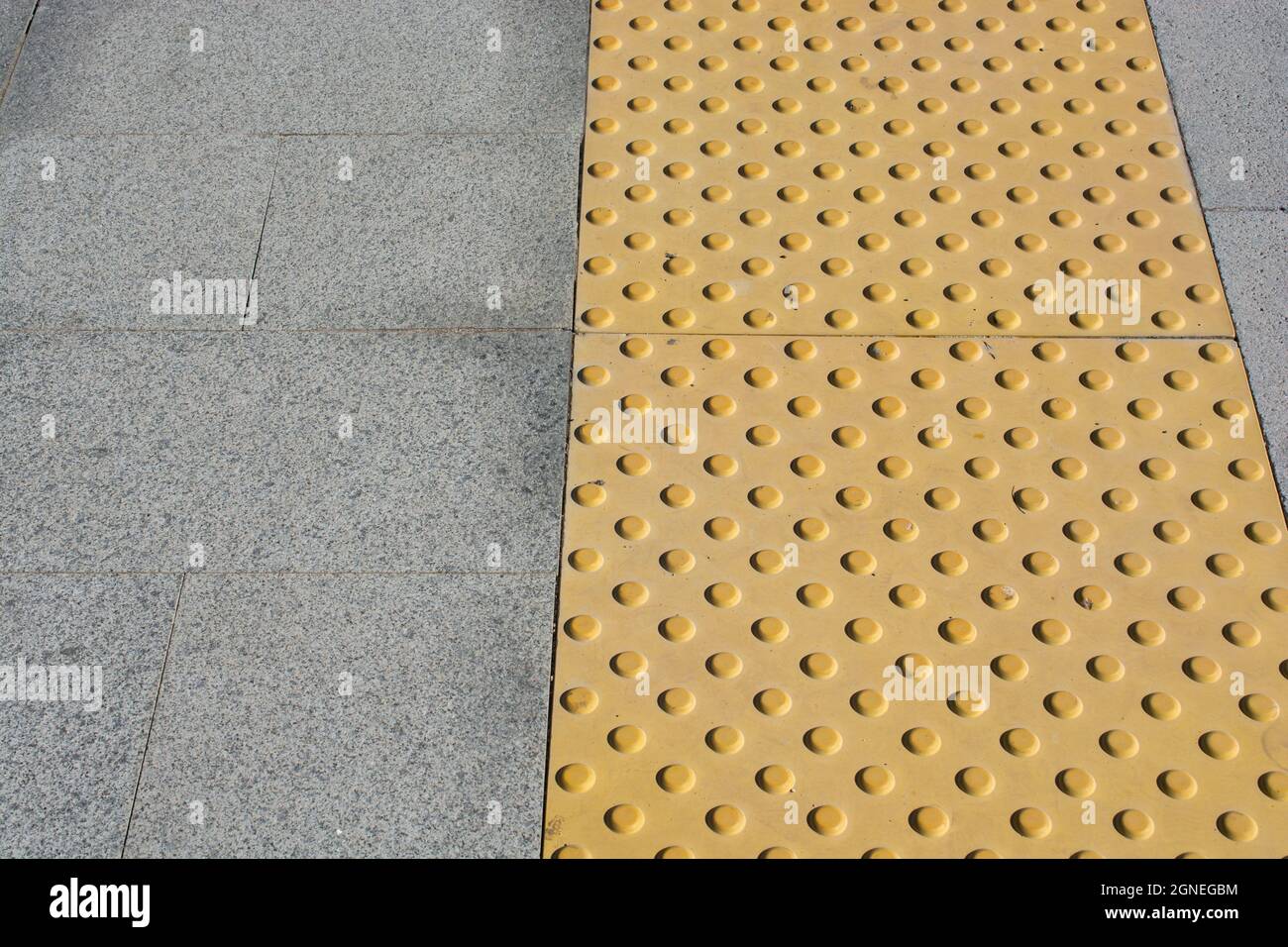 Closeup of tactile warning tiles for blind people Stock Photo - Alamy