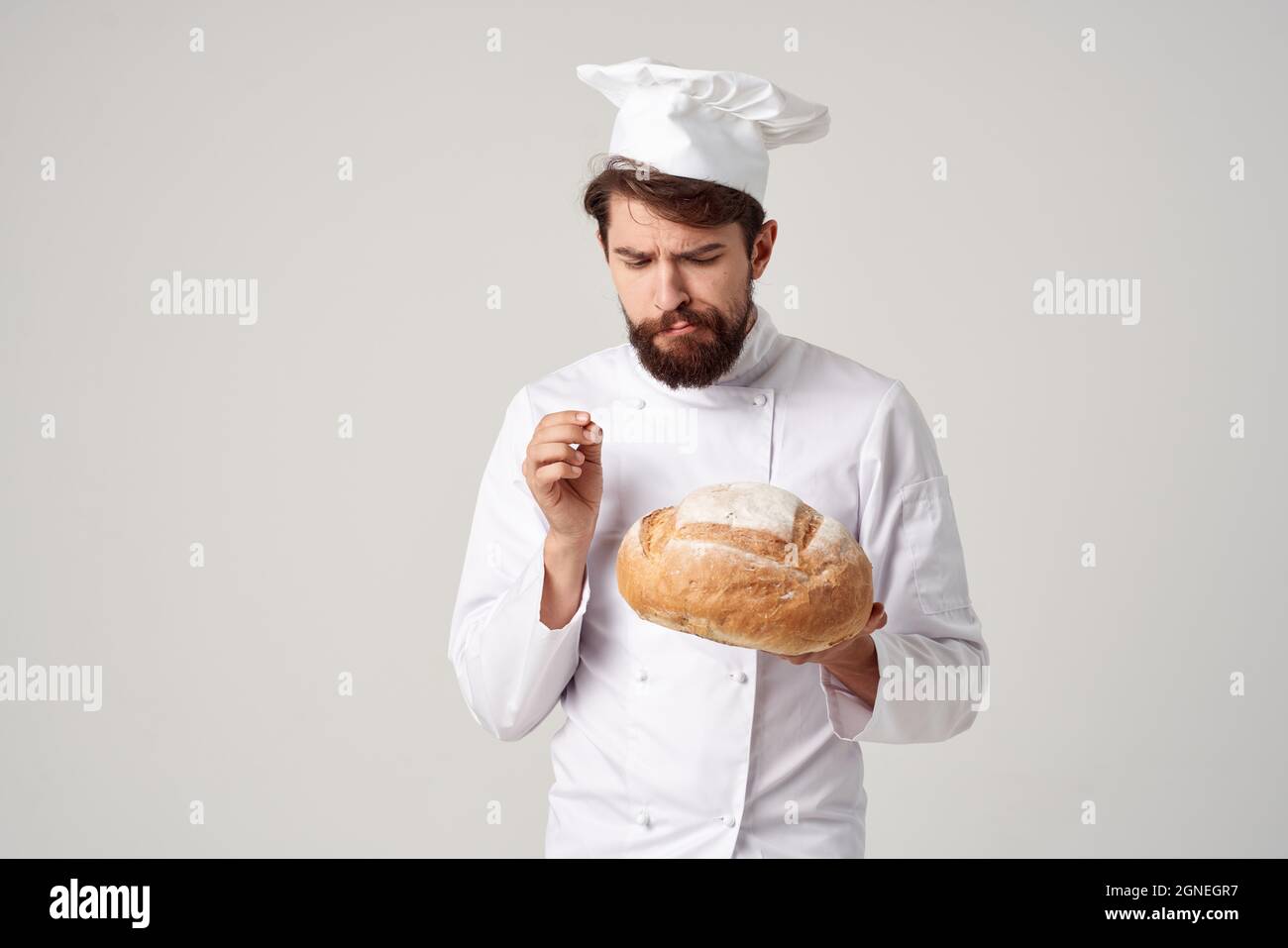 Baker with bread in hand Professional emotions Stock Photo - Alamy