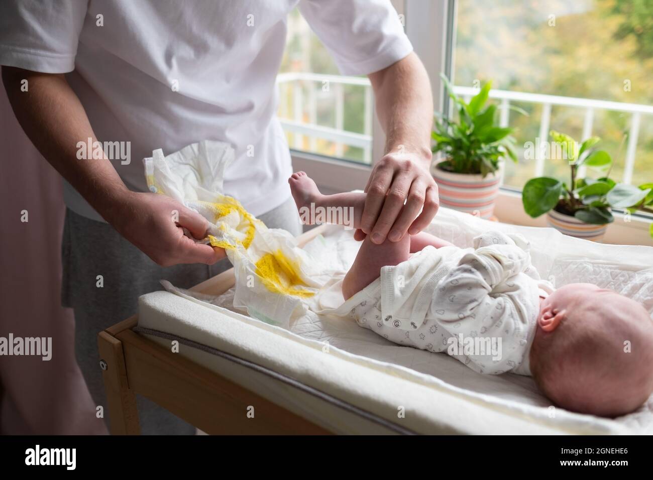 Changing diaper boy hi-res stock photography and images - Alamy