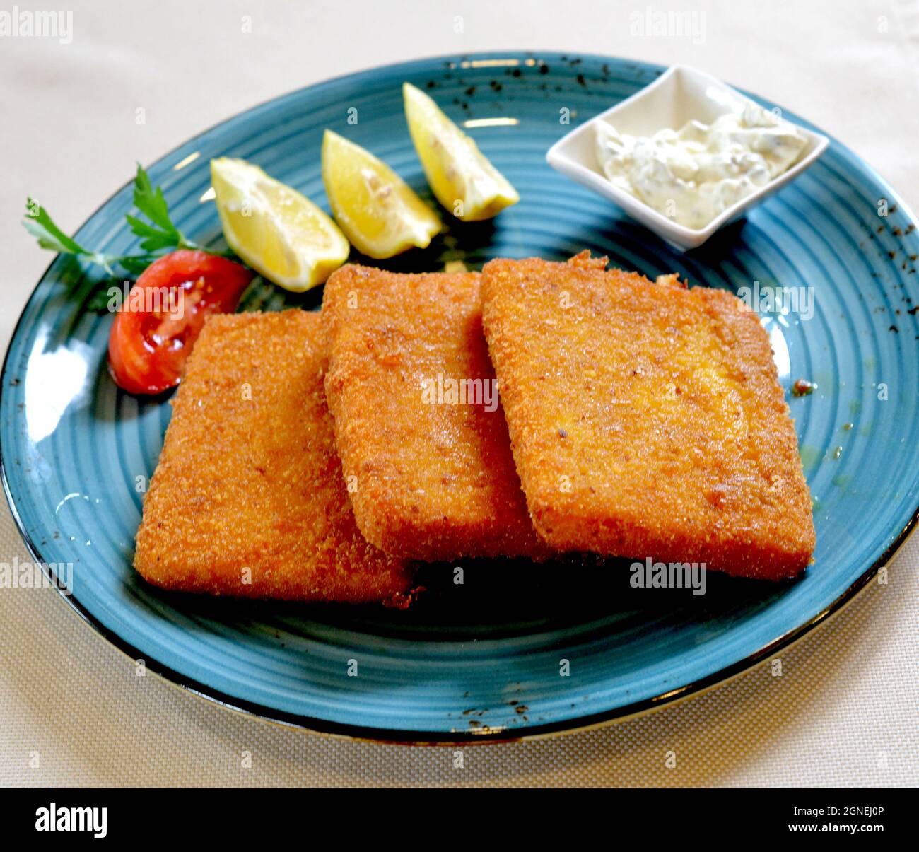 three pieces of a breaded cheese Stock Photo - Alamy