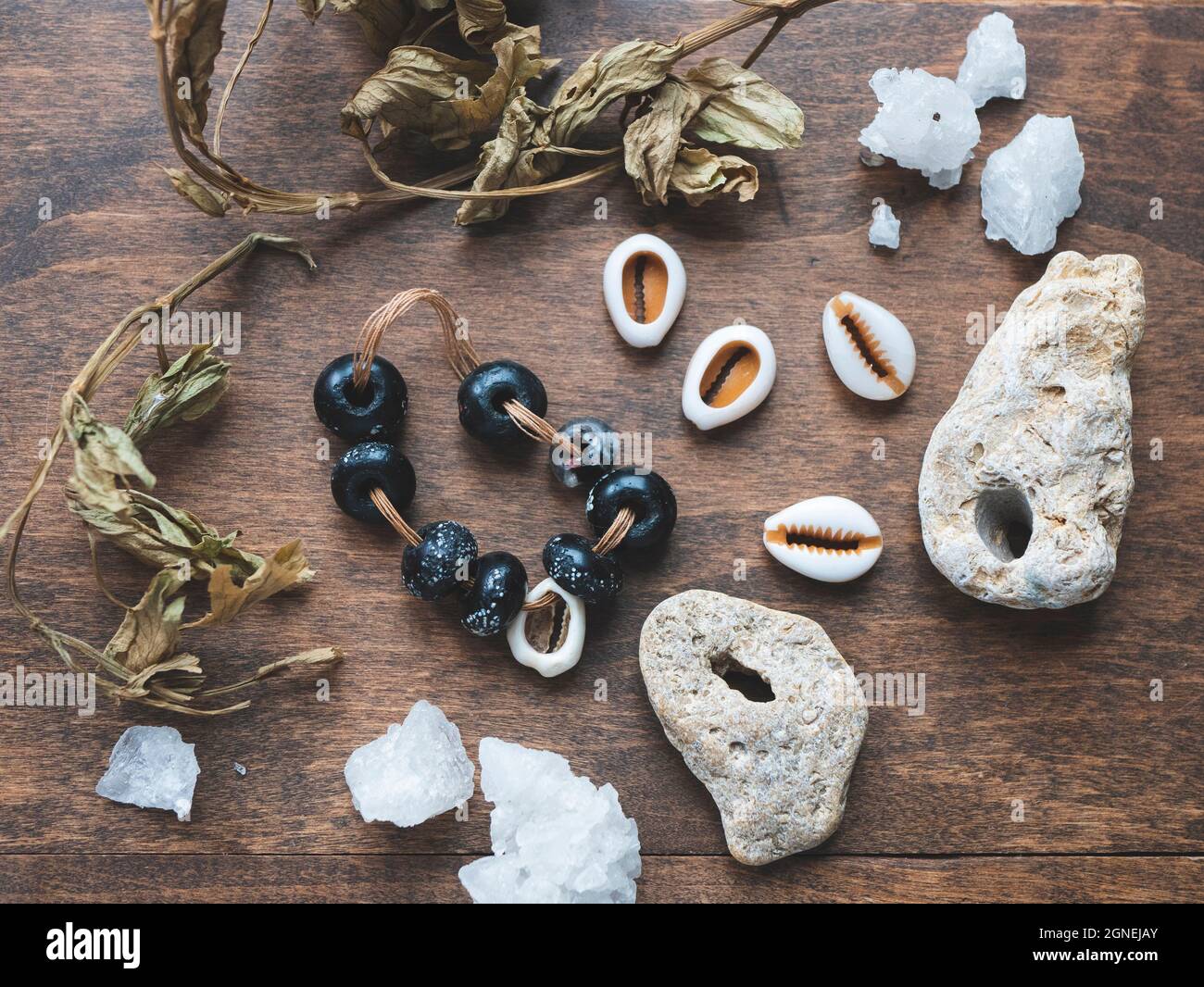 Secret or mysterious ingredients: talisman, dry herbs, cowrie shells ...