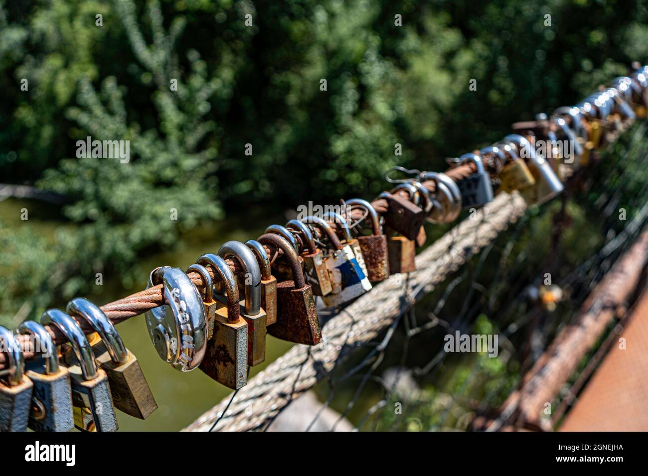 Different coloured locks left on the wire railing of a 100 year old ...
