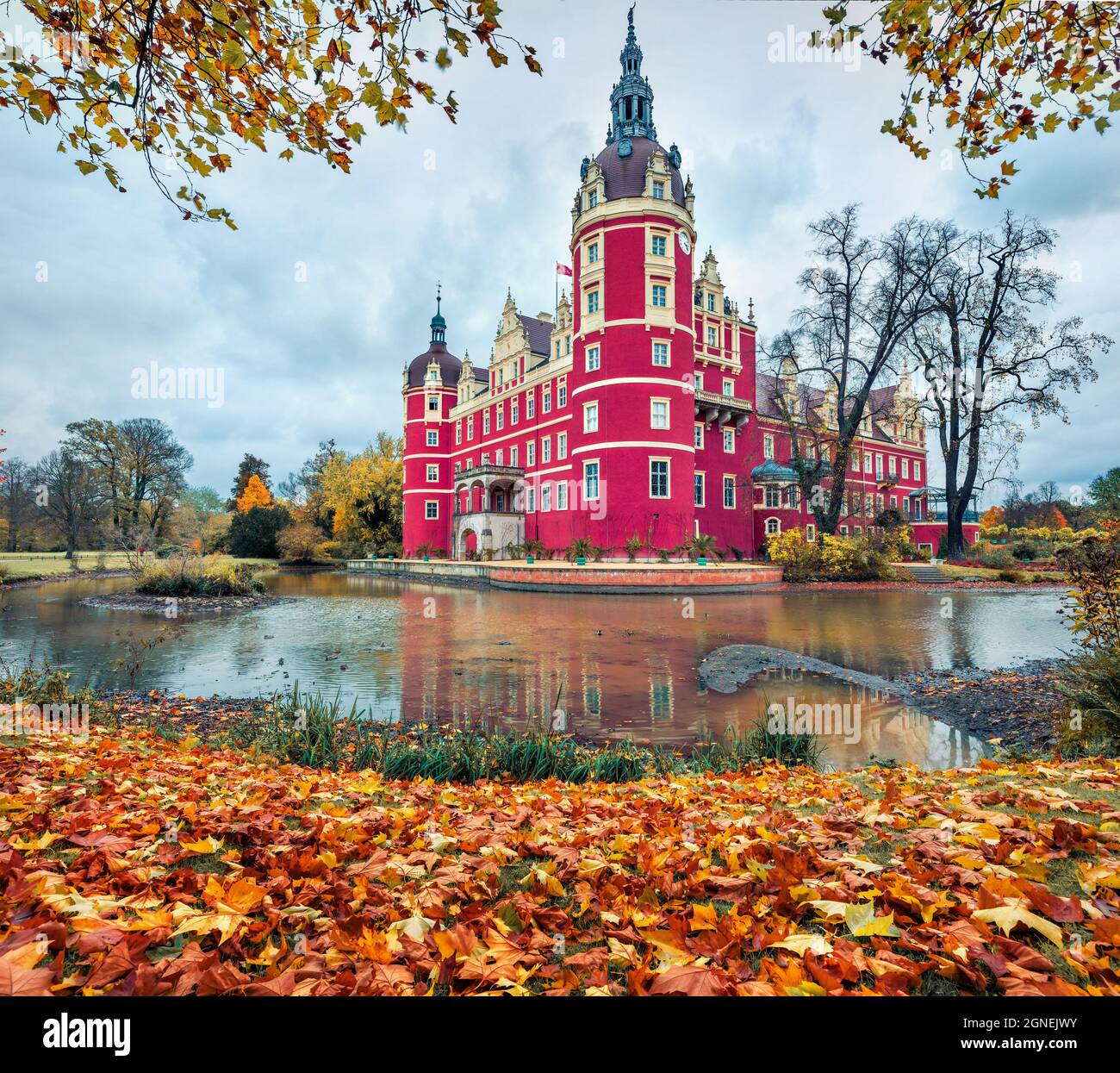 Spectacular autumn morning of Muskau castle. Rainy morning scene in ...