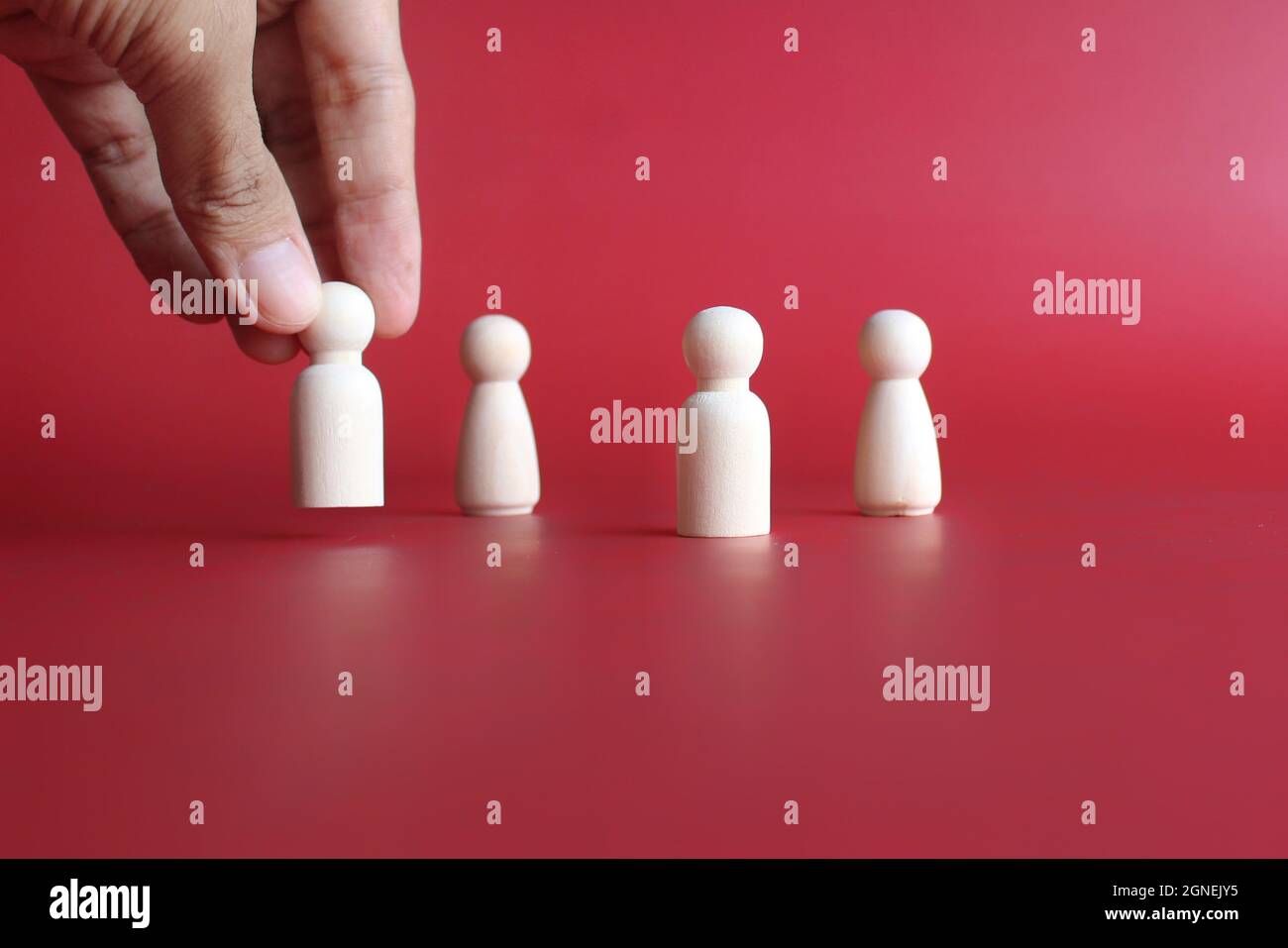 Selective focus image of hand choose people standing out from the crowd ...
