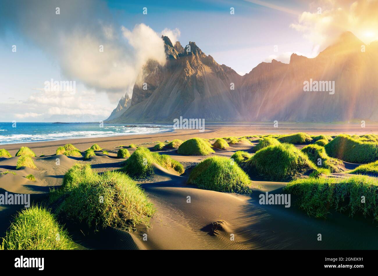 Impressive summer view of green dunes on the Stokksnes headland with ...