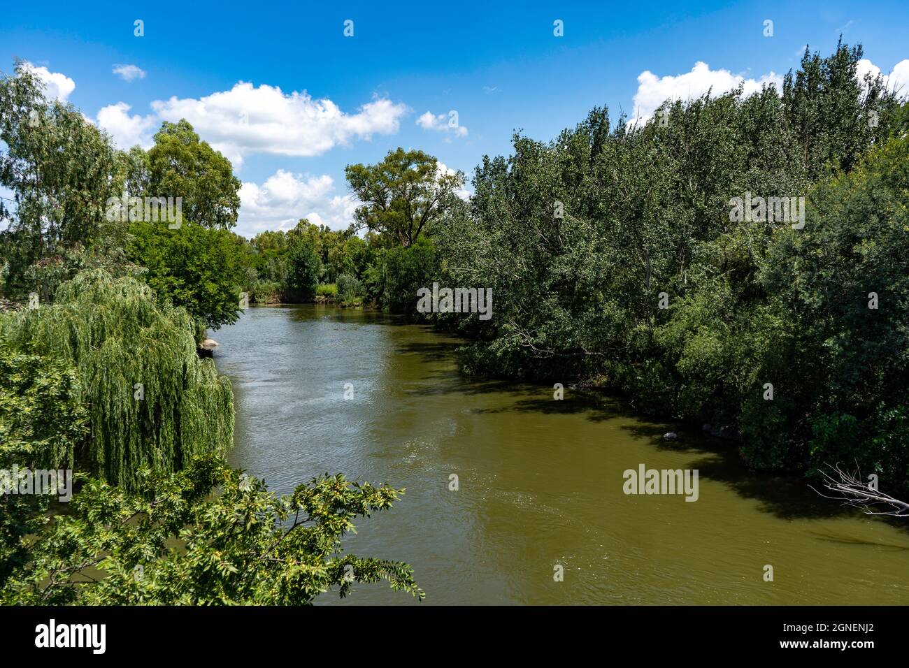 View down the Vaal river, Parys, South Africa showing the running water ...