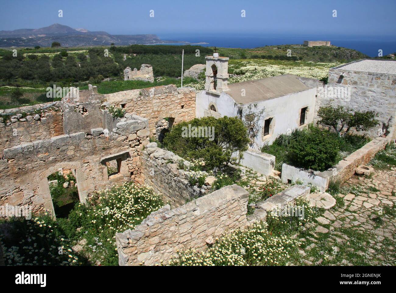 Chapel, ruins of monastery and spring flowers at ancient city of Aptera ...