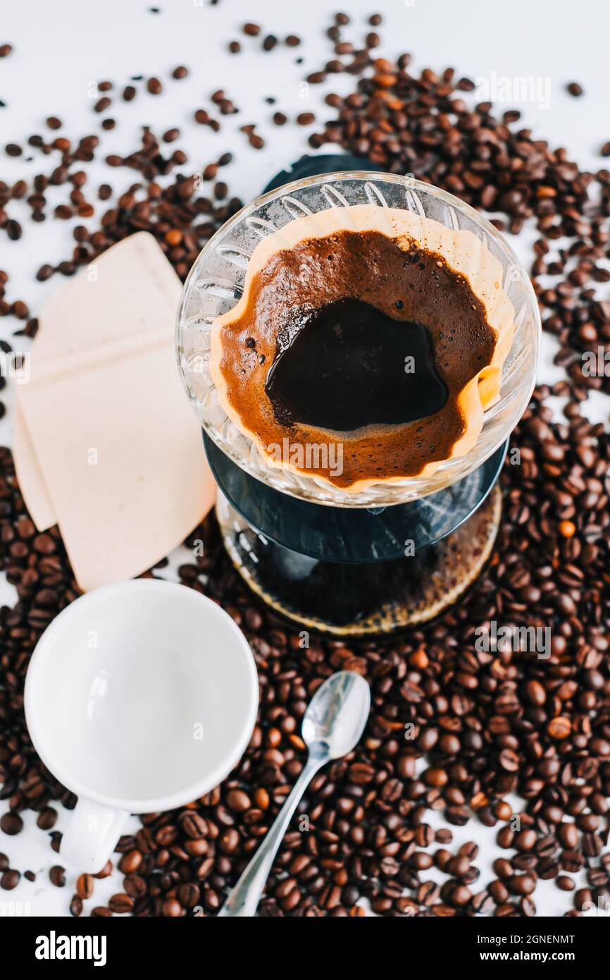 Fresh brewed coffee in a cup using Alternative method, with pour over ...