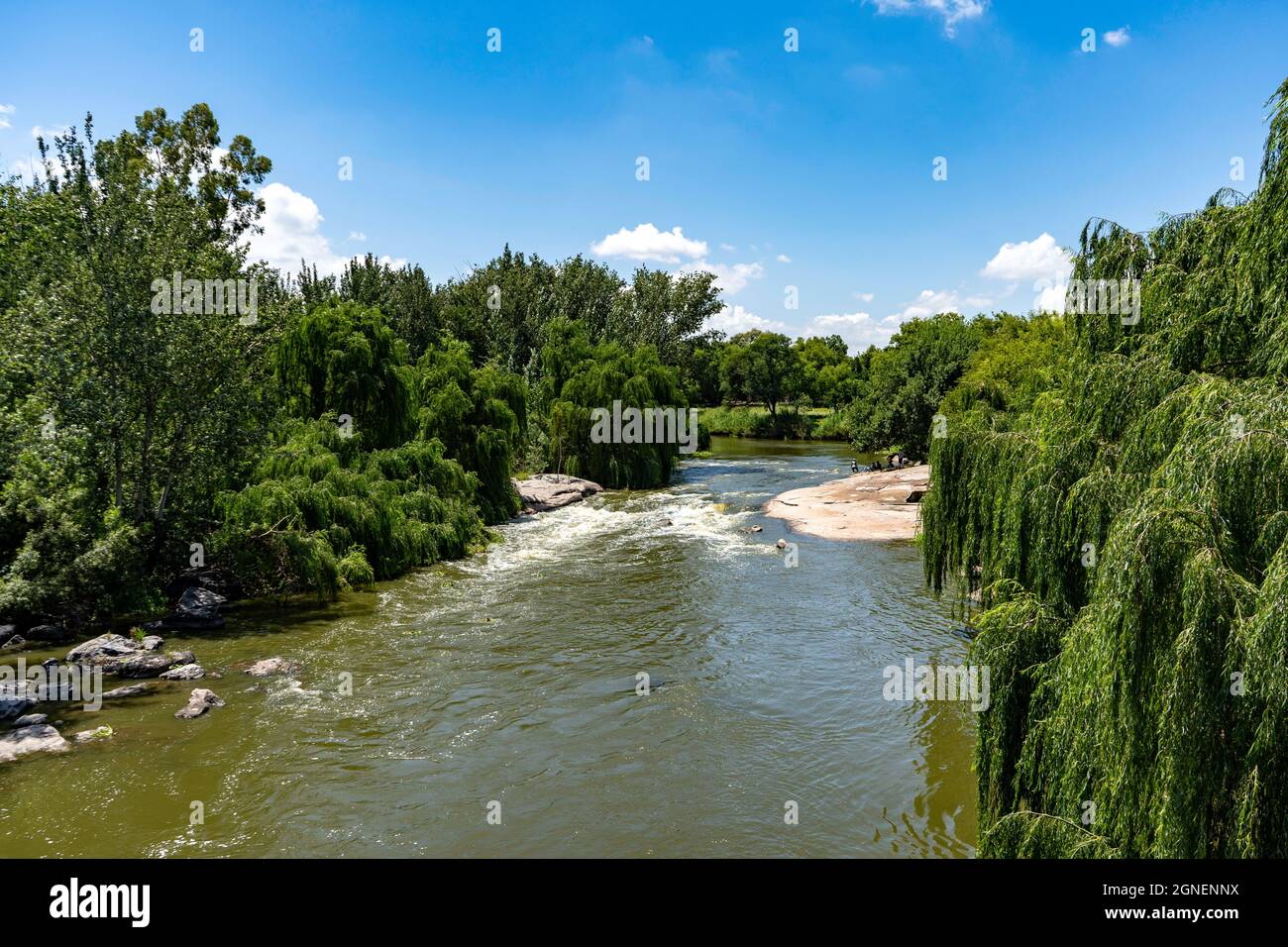 View down the Vaal river, Parys, South Africa showing the running water ...