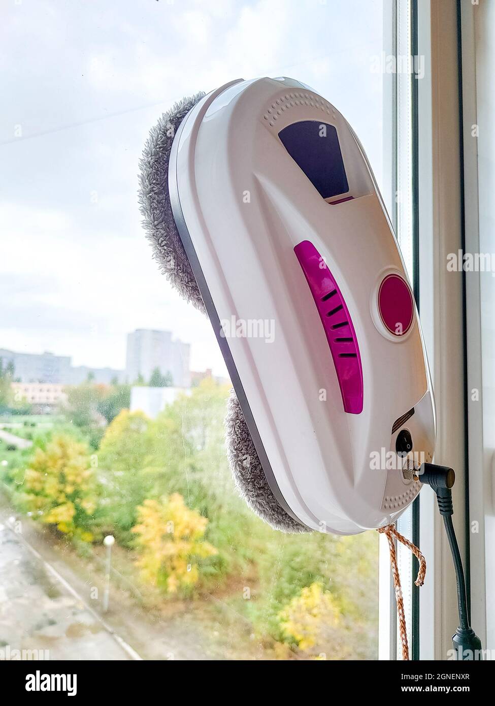 Vacuum cleaner robot washing glass window. Robot window cleaner Stock ...