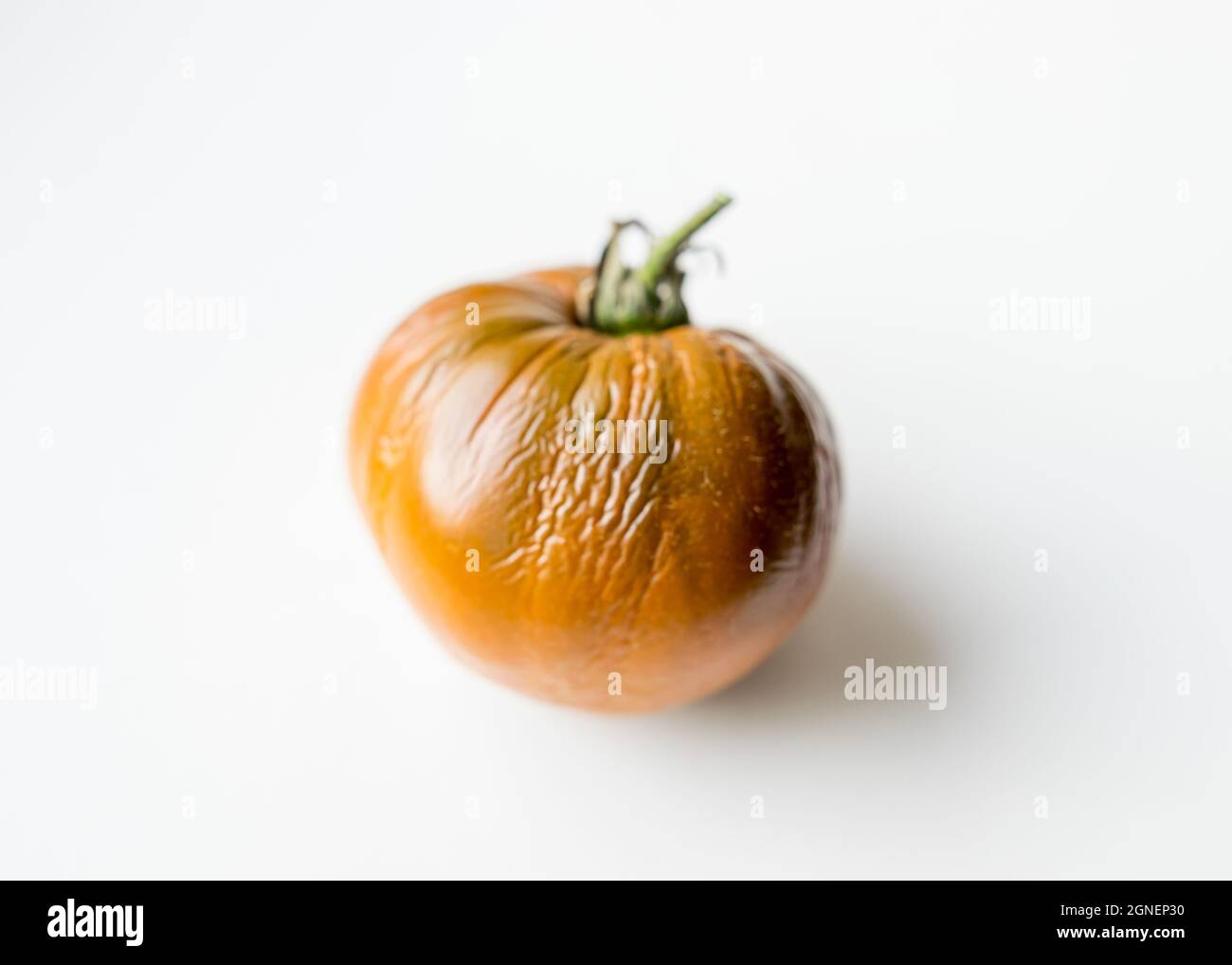 photo with withered and wrinkled tomatoes on a light background ...
