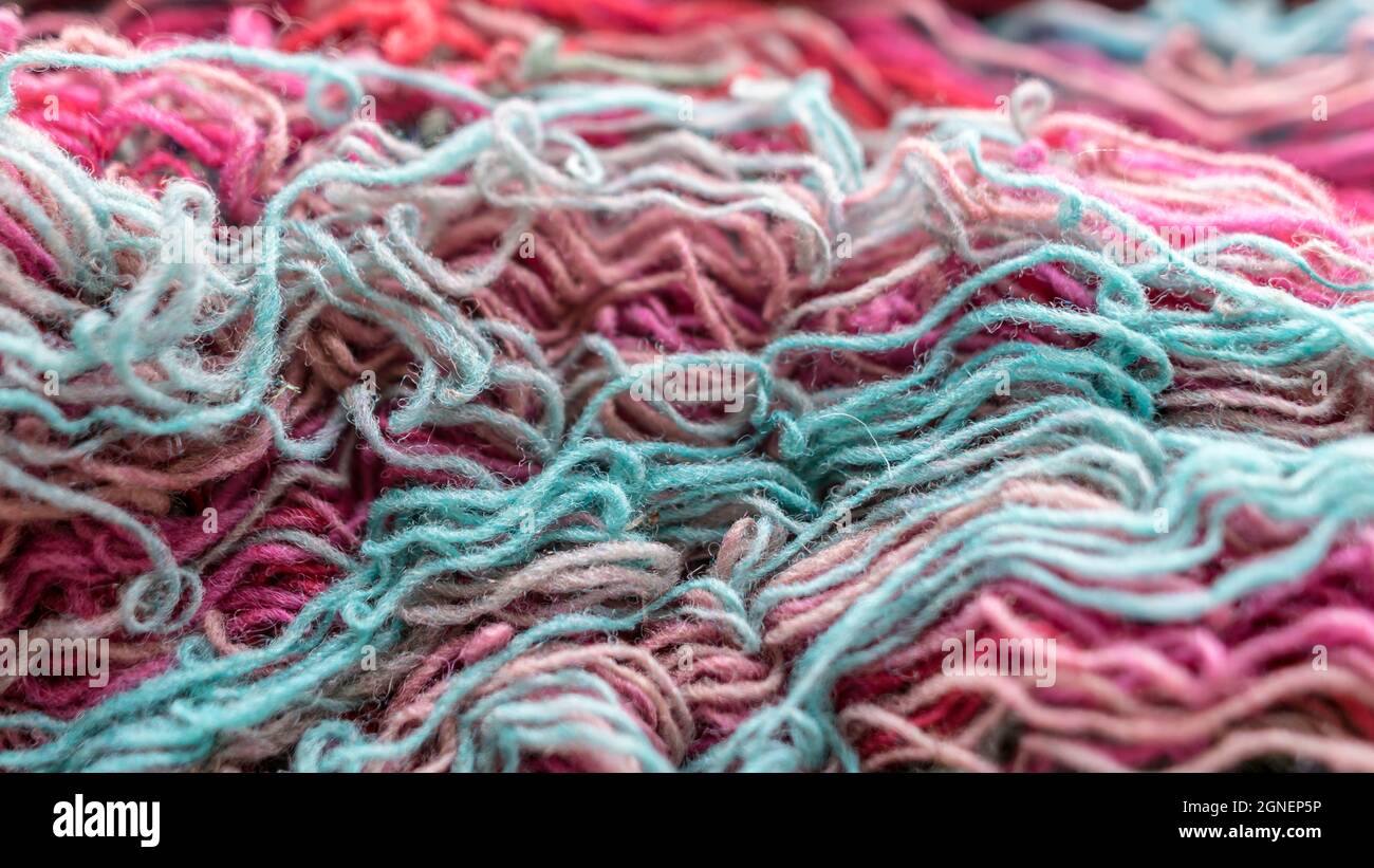 photography with colorful, variegated, bright wool yarn fragments ...