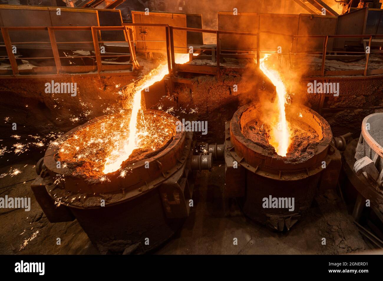 Blast furnace slag tapping. The molten slag is poured into a ladle ...