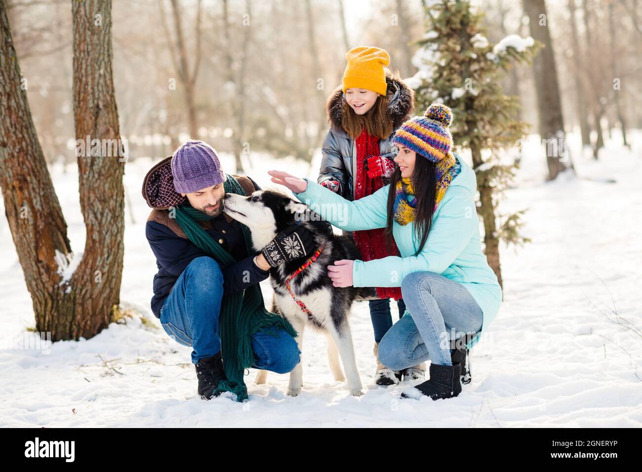 Full length photo of lovely family happy positive smile walk park pet ...