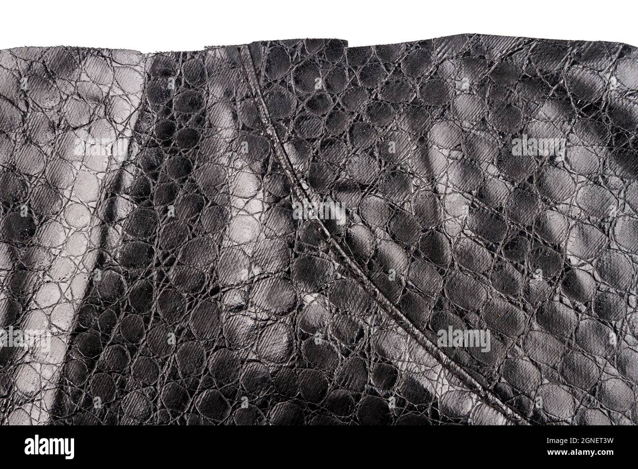 Piece of black artificial leather isolated on white background. Fake ...