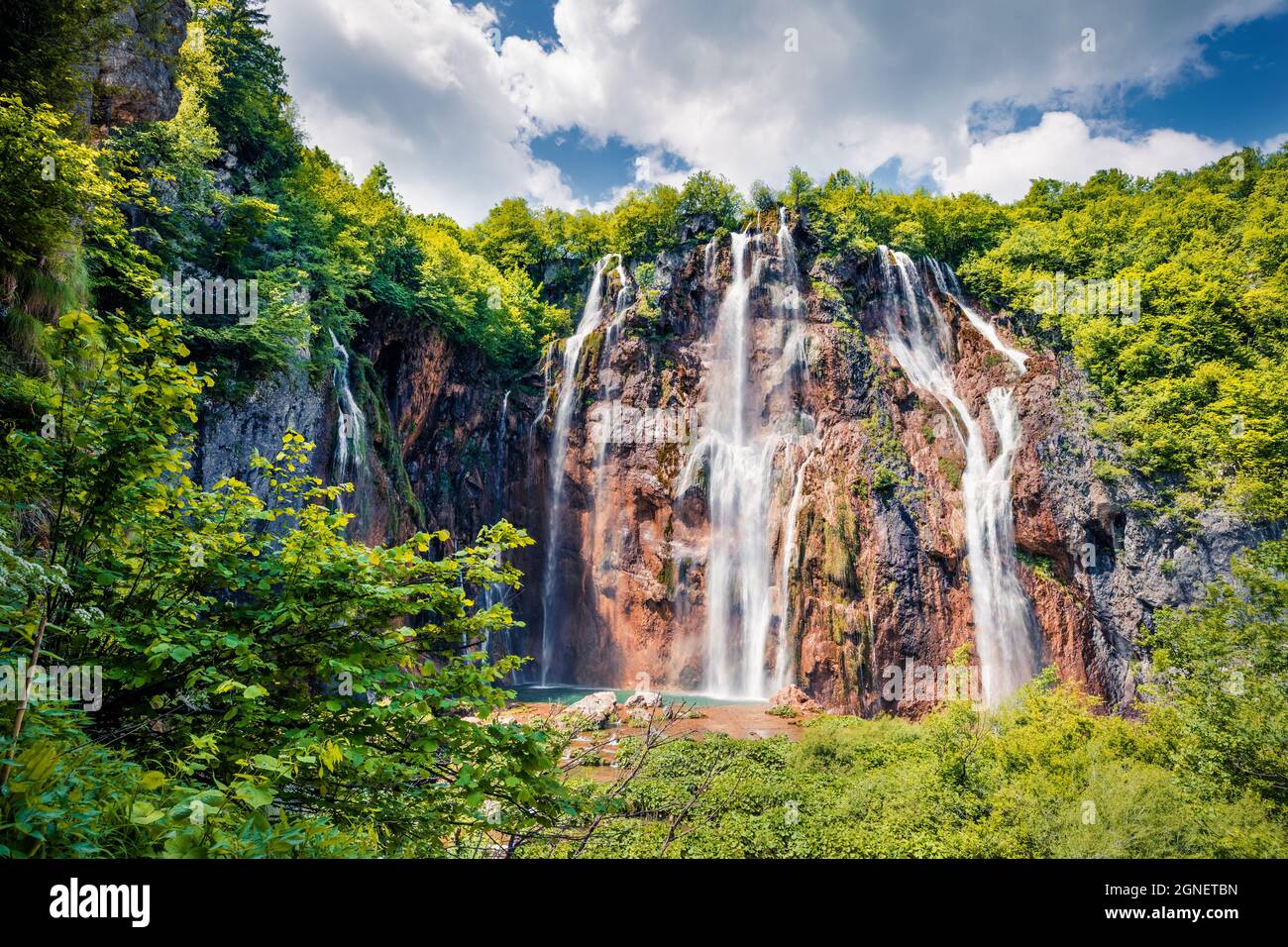 Colorful spring scene of green forest with pure water waterfall in ...