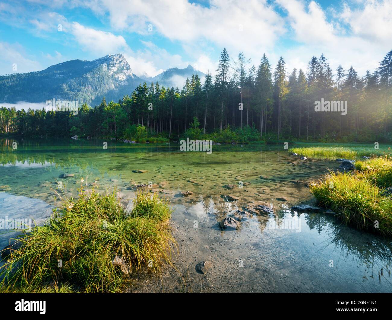 Misty summer view of Rotpalfen and Hochkalter Mountain Peaks. Sunny ...