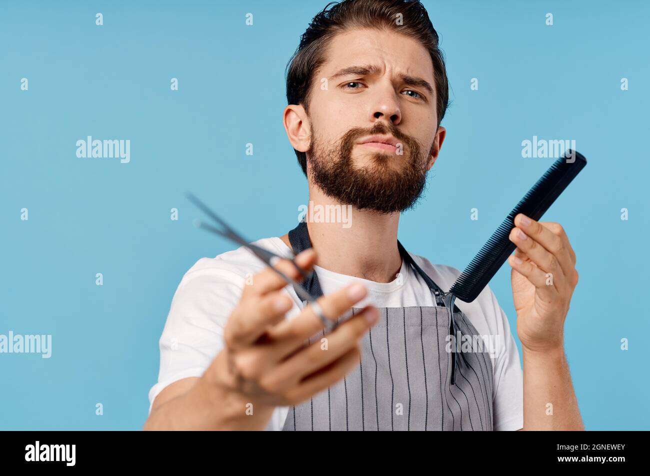 bearded man beauty saloon blue background Stock Photo - Alamy