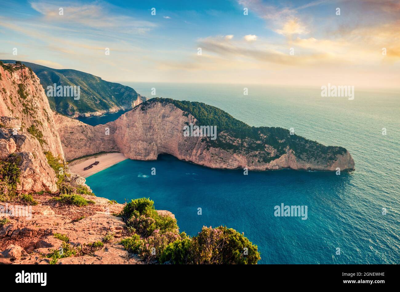 Colorful spring view of Navagio beach with shipwreck. Sunny evening ...