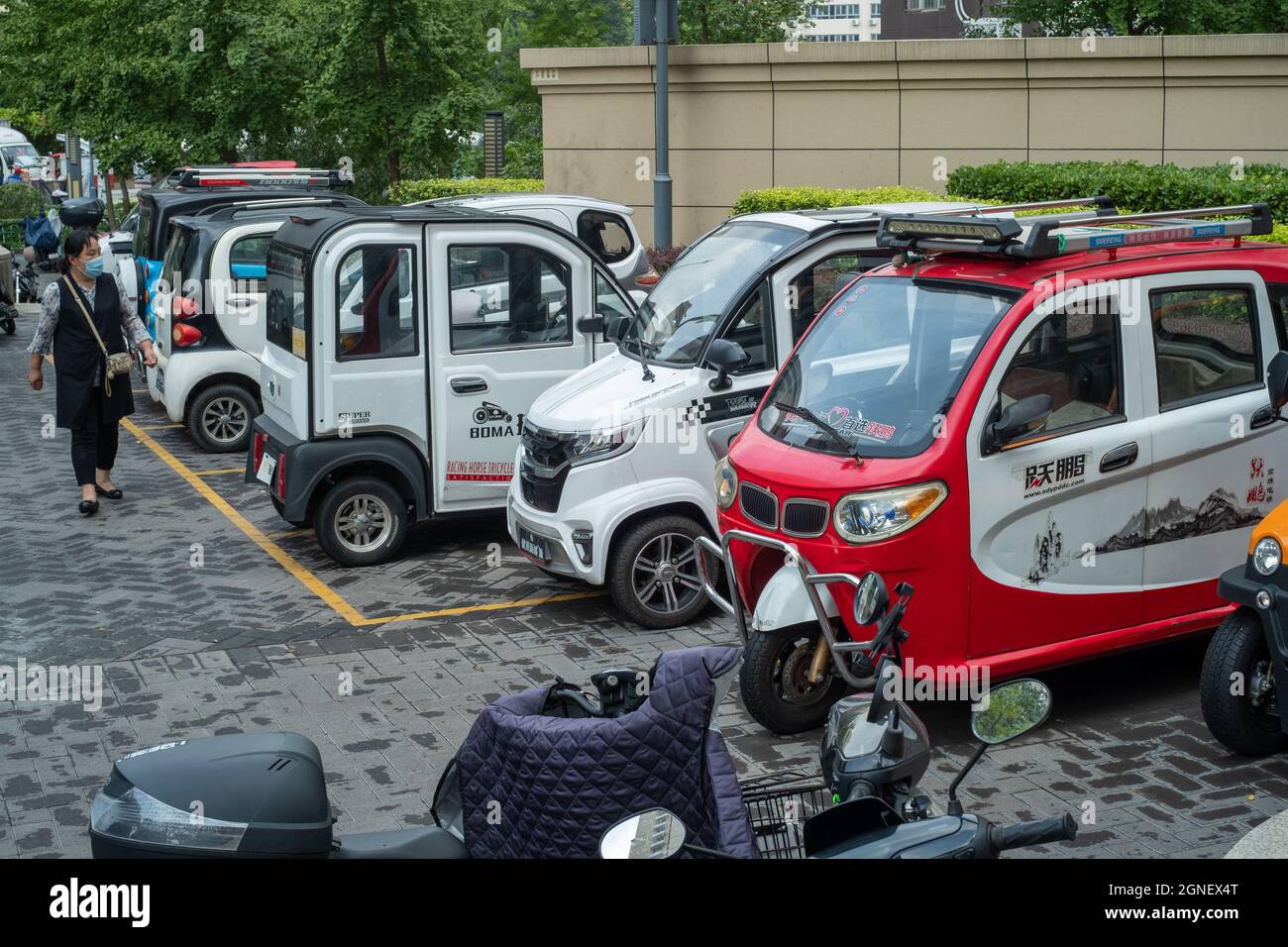 Mini electric cars park in a community in Beijing, China. 25-Sep-2021 ...