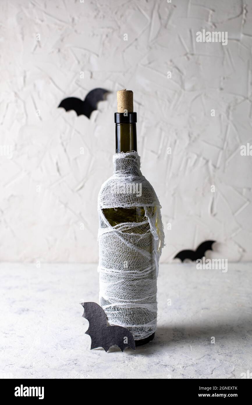 Bottle of cocktail decorated as mummy. Drink for a halloween party for ...