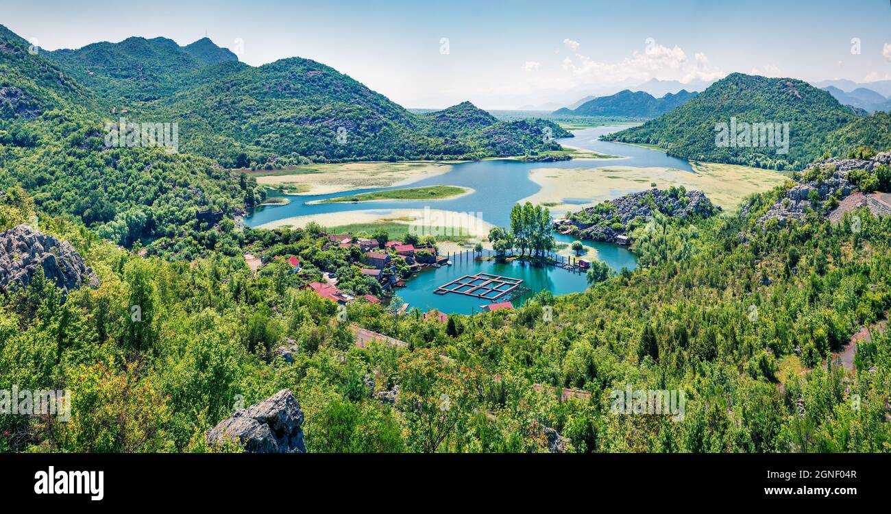 Panoramic view of Rijeka Crnojevica river, Skadar lake location. Bright summer scene of Karuc ...
