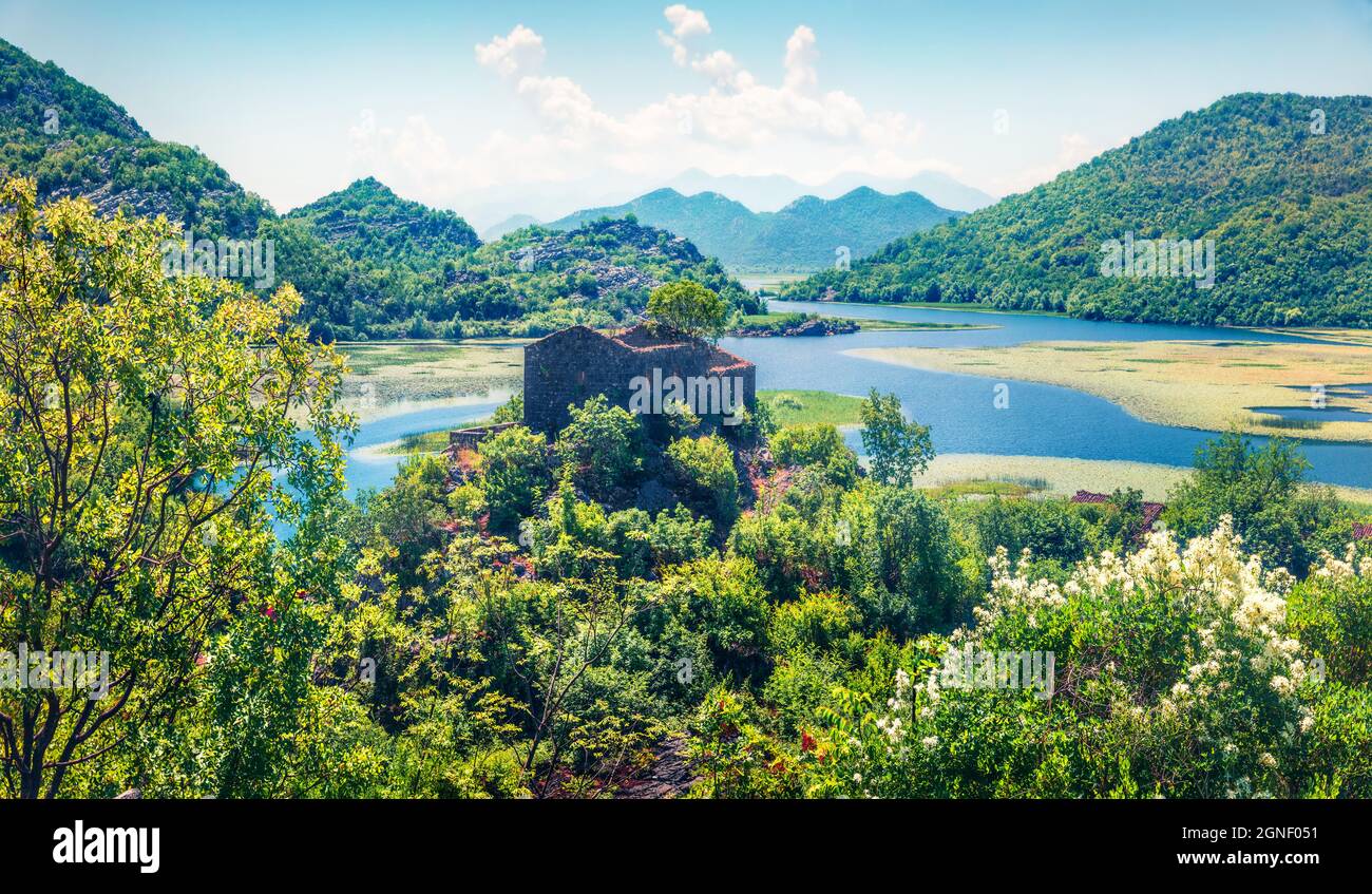 splendid view of Rijeka Crnojevica river, Skadar lake location. Colorful summer scene of Karuc ...